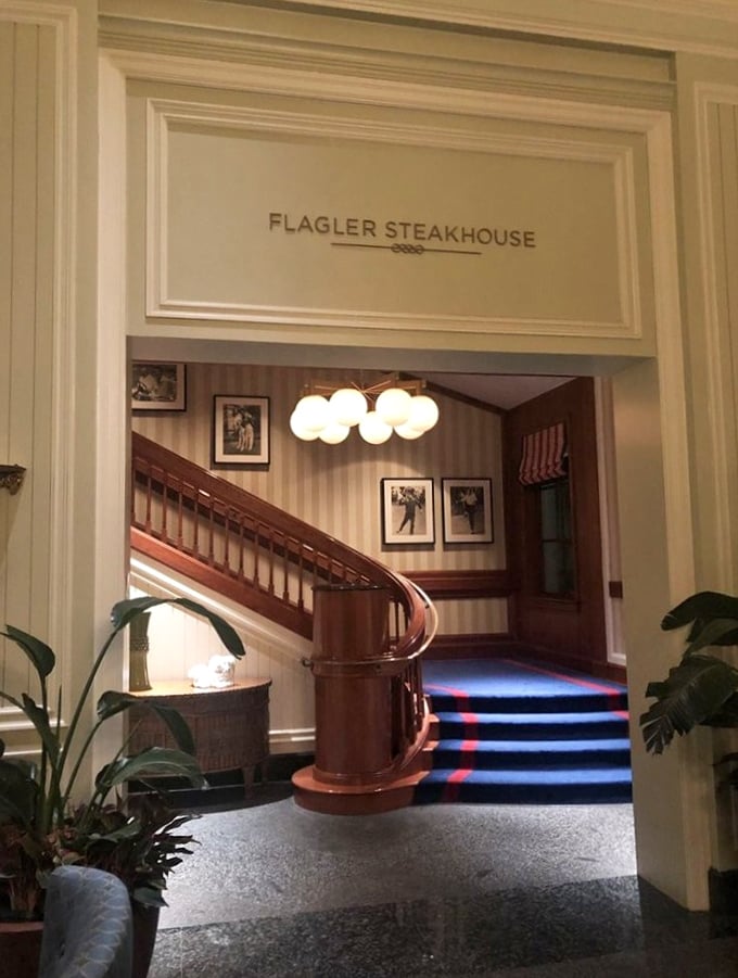Flagler's elegant entryway looks like it belongs in a mansion, not a restaurant. Those globe lights aren't just illumination—they're spotlights for the star of the show: steak.