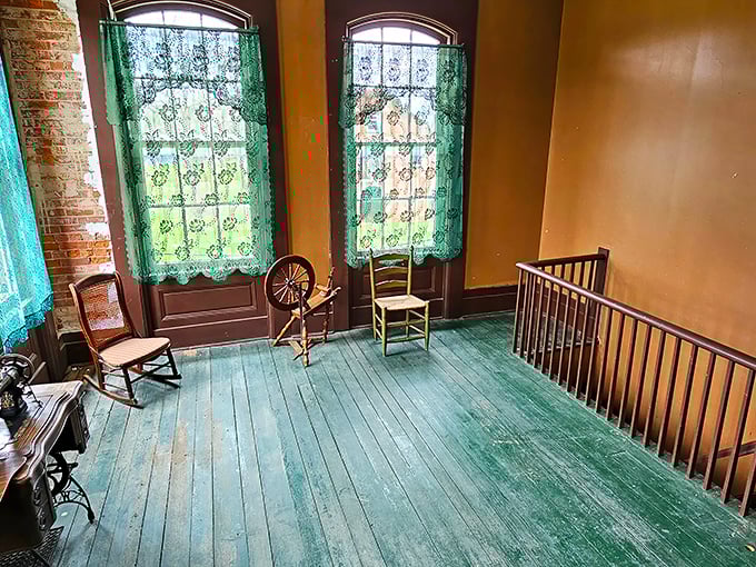 Upper floors where spinning wheels and period furniture create authentic glimpses into 19th-century domestic life.