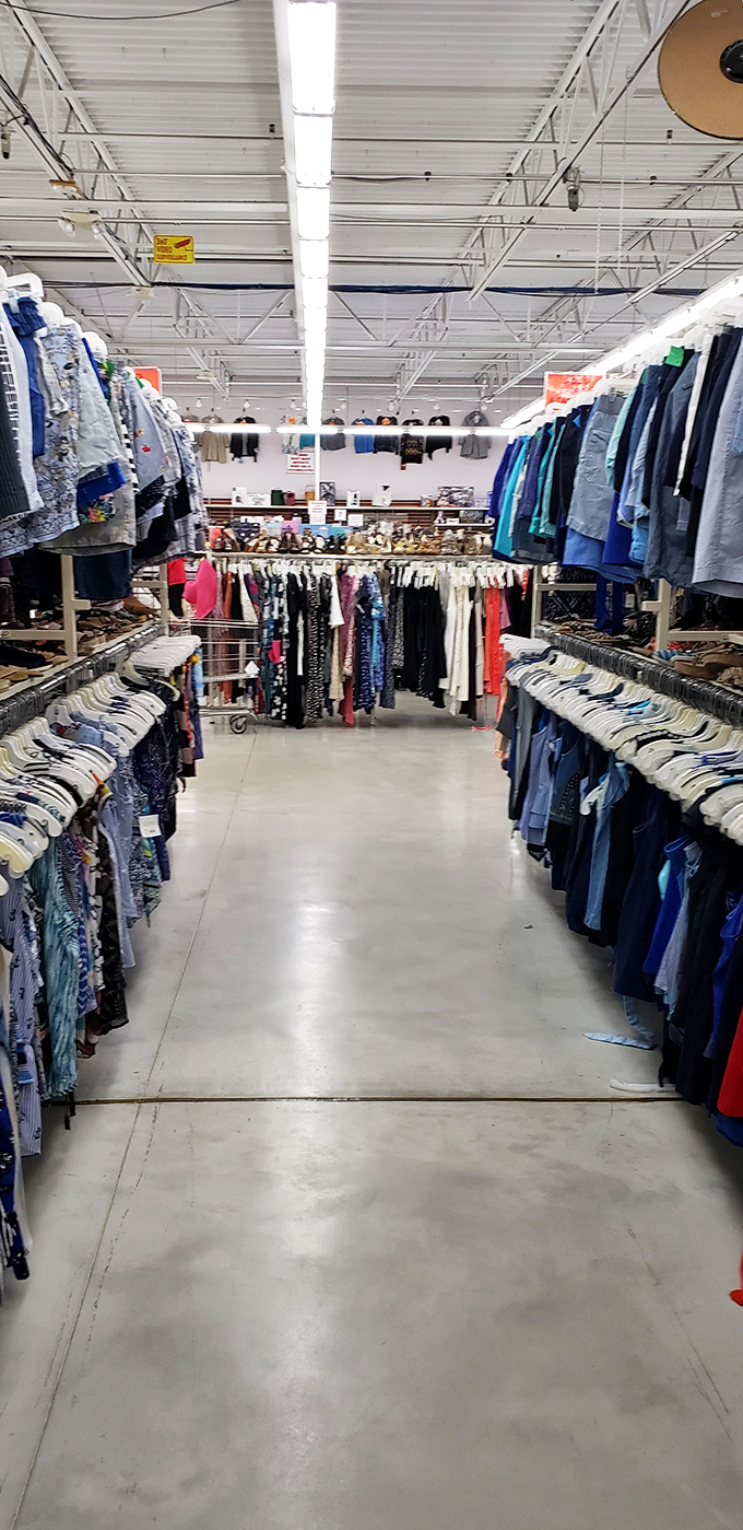 The view down a clothing aisle feels like staring into infinity – a reminder that patience is the secret ingredient in the recipe for thrift success.