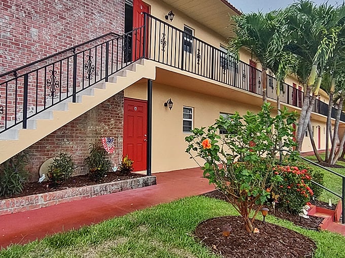 Cheerful red doors welcome residents home. Where "curb appeal" isn't just a real estate term—it's the community philosophy.