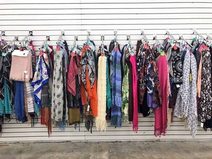 The scarf section explodes with color and pattern—each one telling the silent story of a vacation souvenir or forgotten gift now seeking new adventures.