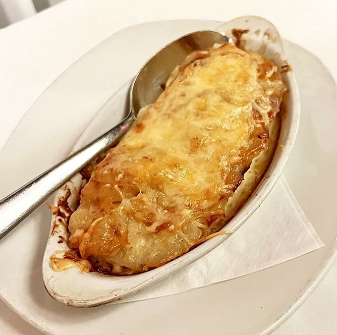 Cheese, bubbling like molten gold over tender potatoes. This isn't a side dish—it's the supporting actor that steals the scene.