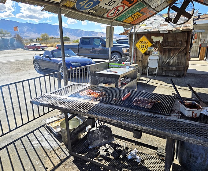 BBQ with a view of the mountains – meat meets heat while nature provides the backdrop. That's not smoke, it's flavor becoming airborne.