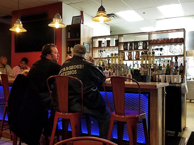 The bar area proves that great barbecue deserves great drinks—a philosophy I've been personally advocating for years with religious dedication.