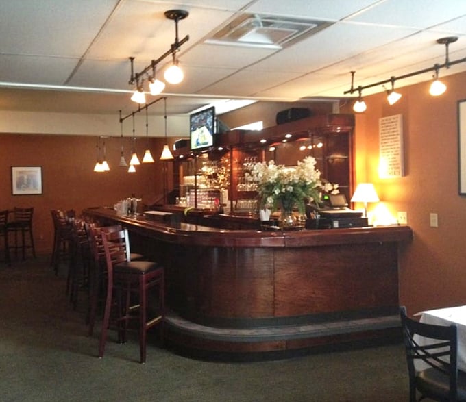 The curved wooden bar invites conversation between strangers who'll leave as friends. Some of life's best stories begin with "I was at this amazing little place in Erie…"