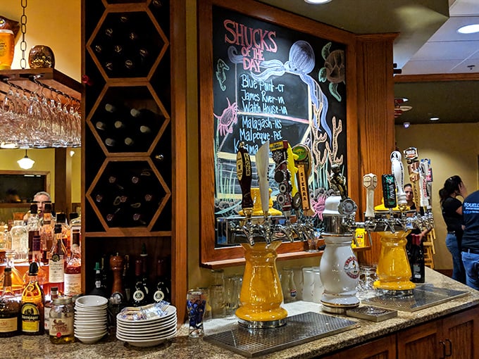 The bar area whispers "stay awhile" with its honeycomb wine storage and chalkboard promising the day's freshest catches—resistance is futile. 