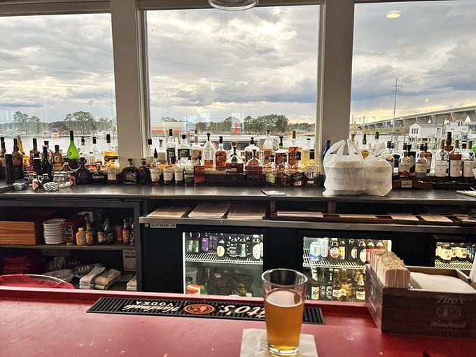 The kind of bar where even the spirits have a water view. That beer isn't just golden—it's liquid sunshine in a glass.