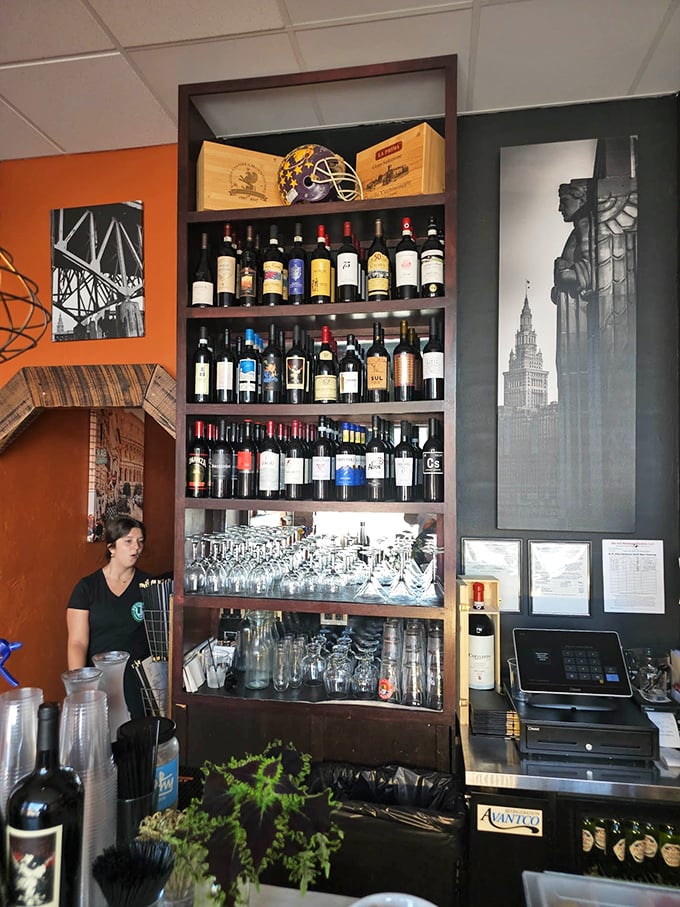 Wine bottles standing at attention like soldiers guarding flavor. This isn't a pretentious collection; it's a carefully curated library of happiness.