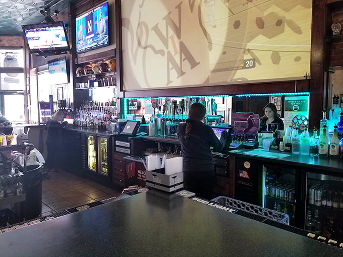 The bar's warm glow creates the perfect backdrop for both victory celebrations and "there's always next season" consolations, with Wisconsin team loyalty proudly displayed.