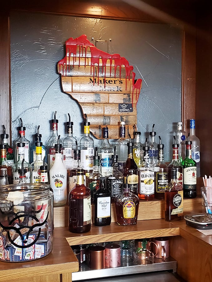 That Wisconsin-shaped liquor display isn't just clever—it's patriotism, state-style. Nothing says "local pride" like bourbon cascading down your homeland.