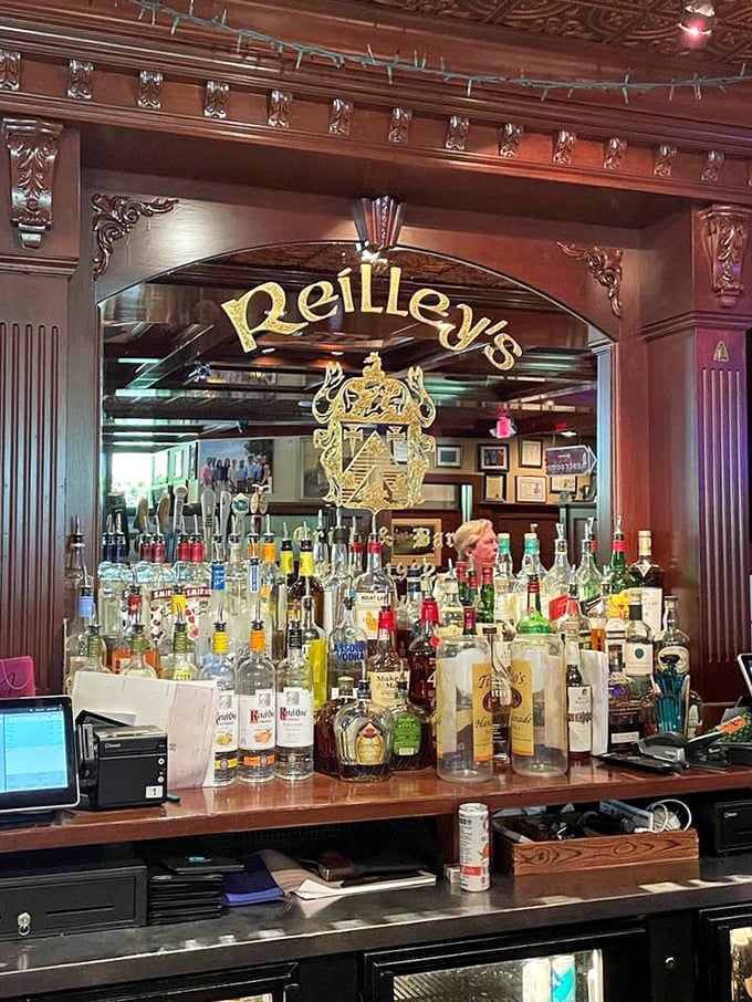 The ornate bar mirror doesn't just reflect bottles—it captures decades of celebrations, first dates, and "I needed that" moments.