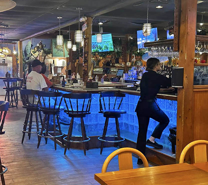 The blue-lit bar – where locals tell fishing stories that grow taller with each cocktail. Truth is optional, good times mandatory.