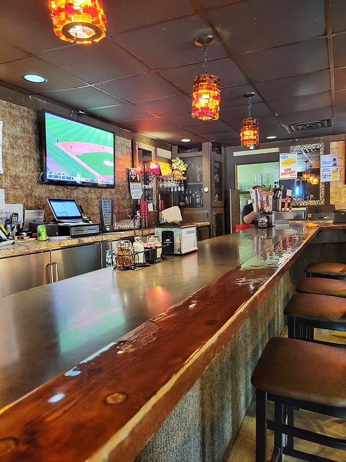 The bar's polished wood counter has supported countless elbows, heard thousands of stories, and witnessed more "cheers" than a Boston sitcom.