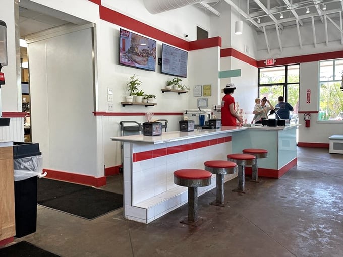 Those classic diner-style stools aren't just seating—they're front-row tickets to the culinary show happening behind the counter.