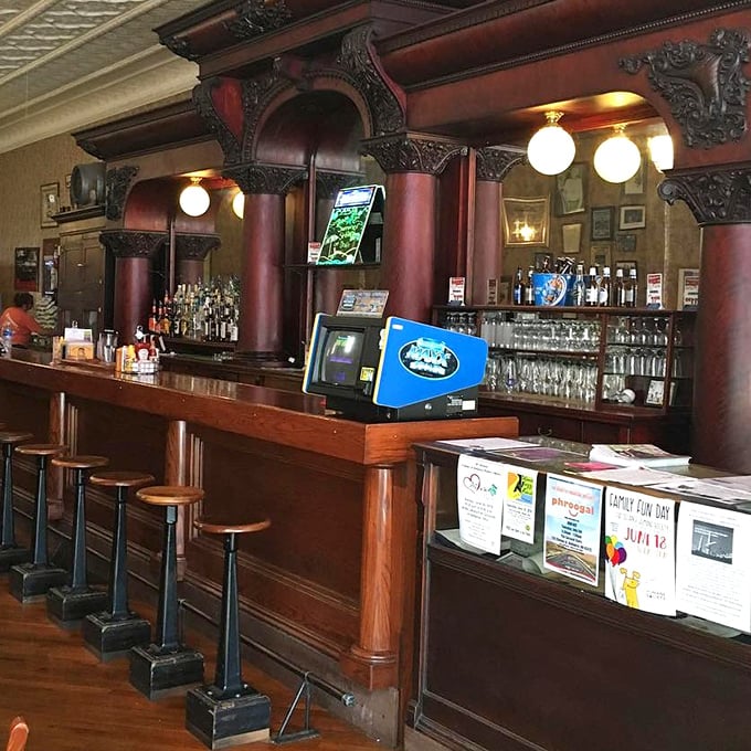 The bar area's rich mahogany and intricate carvings make ordering a beer feel like a scene from an old-time movie.