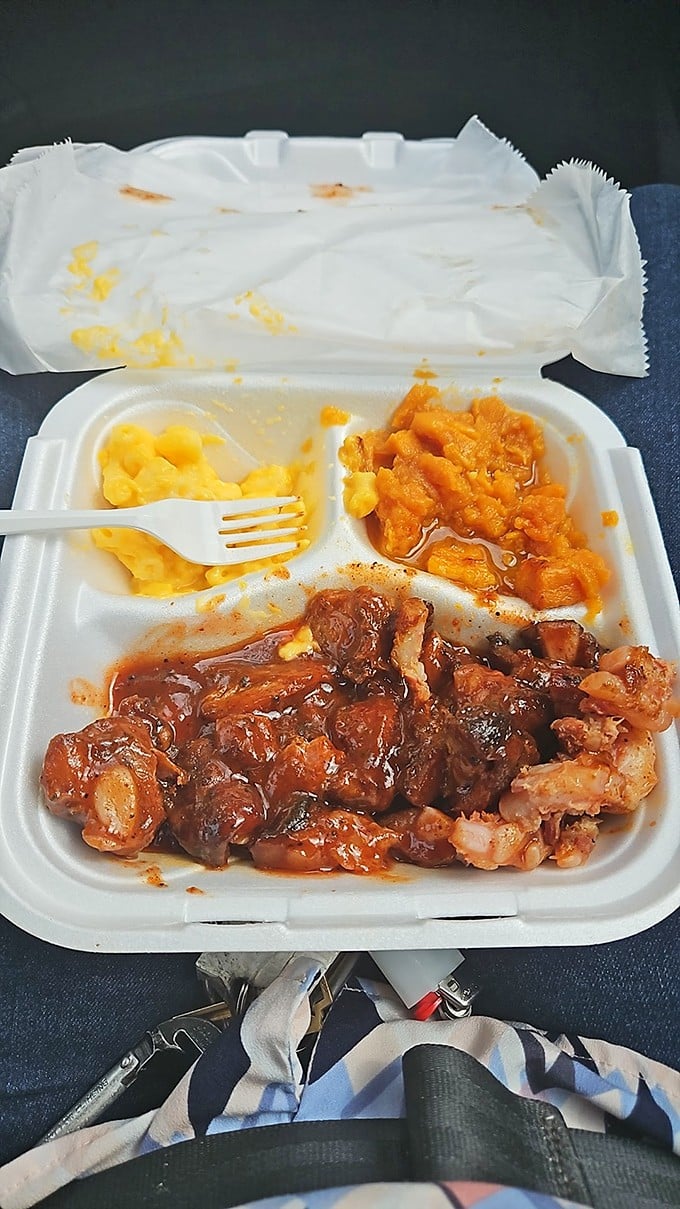 The complete experience: smoky meat, creamy mac, and candied yams. This isn't just takeout—it's a portable feast.
