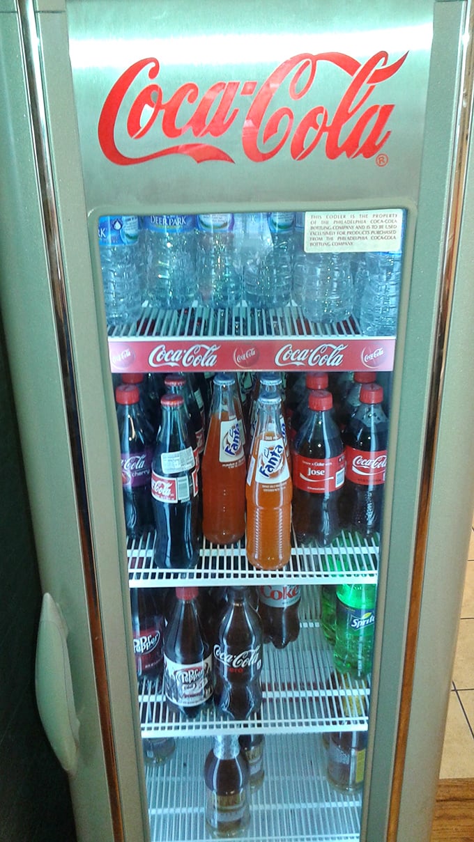 The beverage cooler – that glorious cold vault where classic sodas wait to complement your meal with fizzy, nostalgic perfection.
