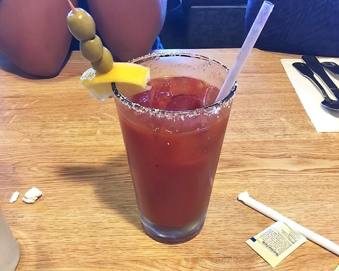 Their Bloody Mary comes properly garnished with olives and a lemon wedge. The salt rim isn't just decoration—it's a flavor essential.