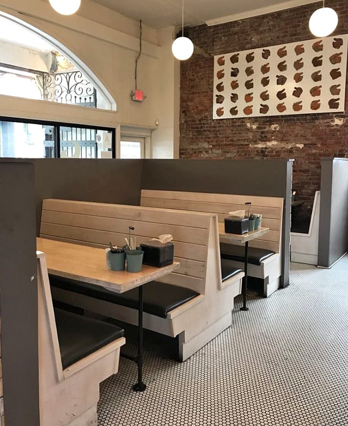 These booths aren't just seating—they're private dining rooms for intimate conversations with your chicken sandwich.
