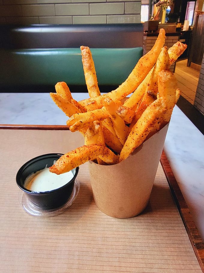 These aren't ordinary fries—they're crispy vehicles for that addictive dipping sauce, seasoned with spices that will haunt your dreams in the best possible way.