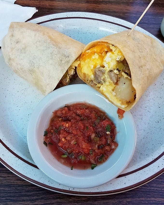 Breakfast burrito perfection – where eggs, cheese and potatoes meet in harmony, with salsa that adds just enough kick to wake up your taste buds.