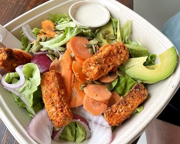 A salad that proves healthy eating doesn't have to be punishment—those tempeh pieces are the supporting actors stealing the whole show.