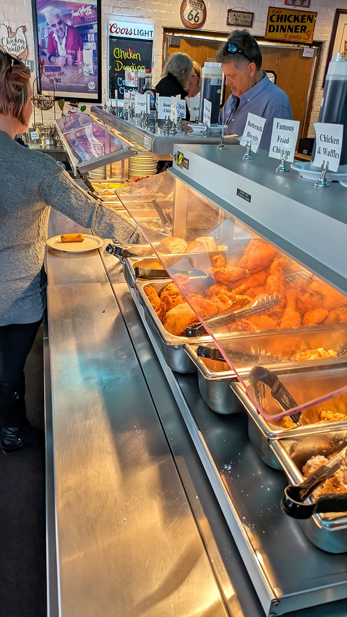 Behold the promised land – where golden-fried treasures await your selection. This buffet line is where dreams and diets part ways.