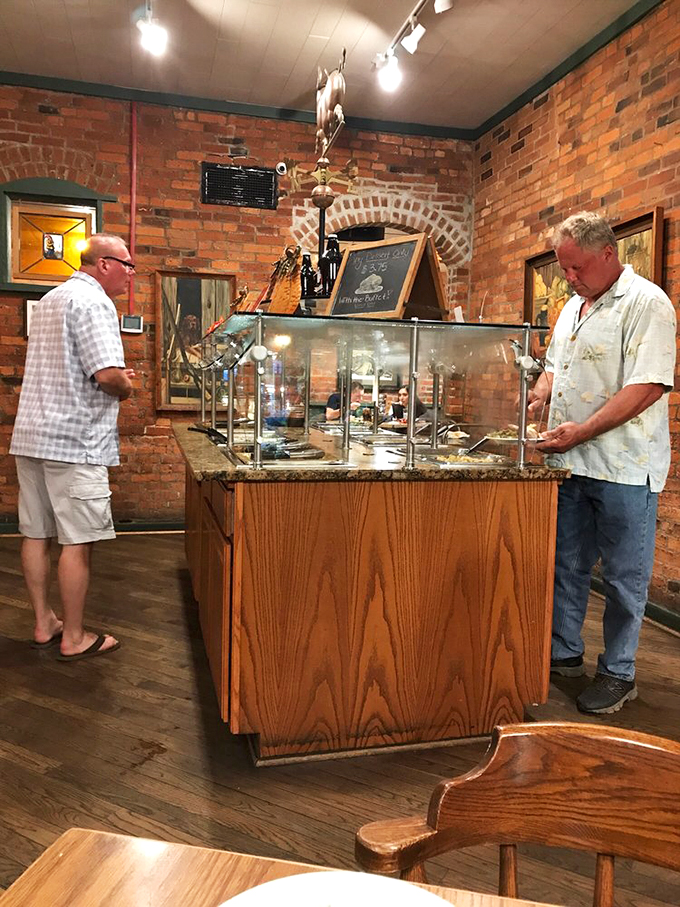 The buffet display case—where sausage dreams come true and diet plans go to die a delicious death.