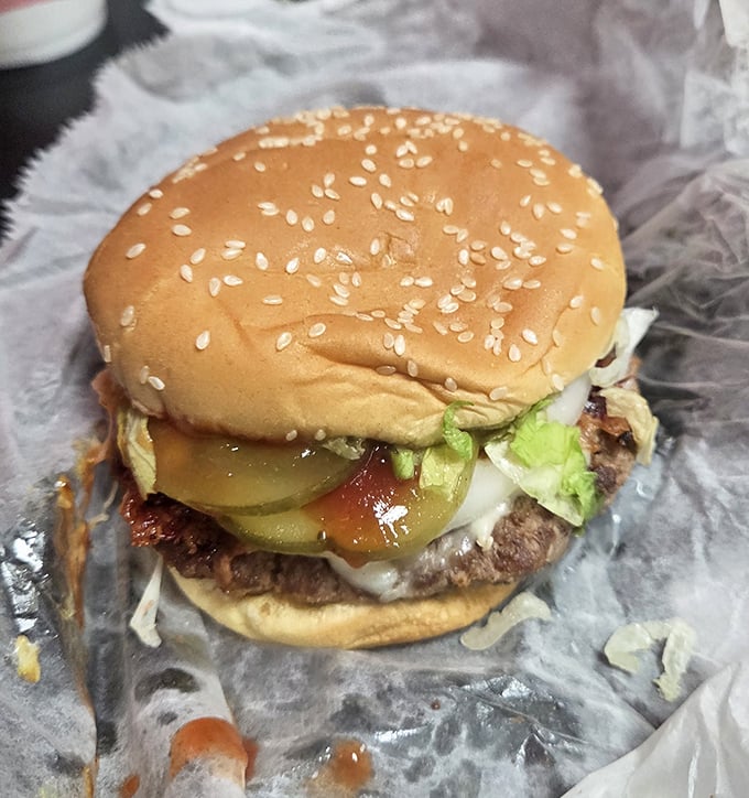 This isn't just a burger—it's a hand-formed masterpiece where pickles, lettuce and beef achieve the harmony that world leaders can only dream about.