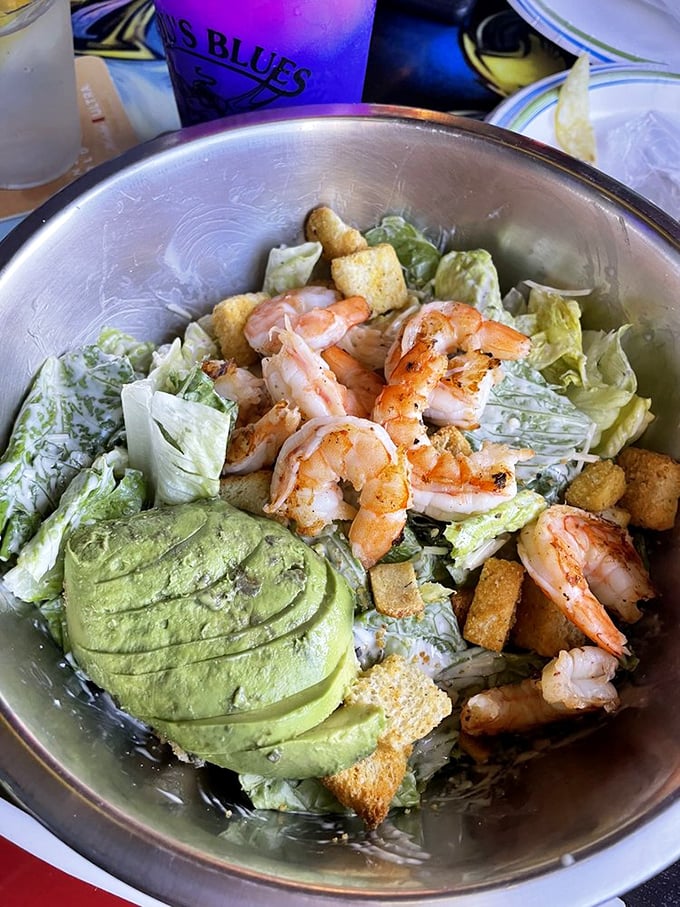 A Caesar salad that actually deserves its imperial name – fresh, abundant, and topped with perfectly grilled shrimp. No assassination worries here.
