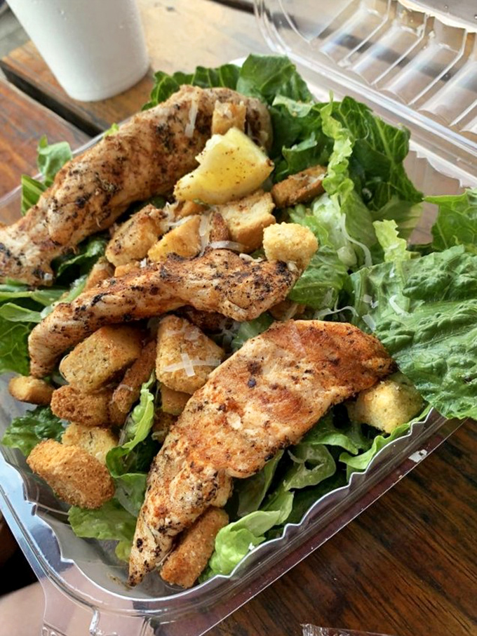 Even the salads mean business here – fresh greens topped with perfectly seasoned fish that makes eating healthy feel like cheating.