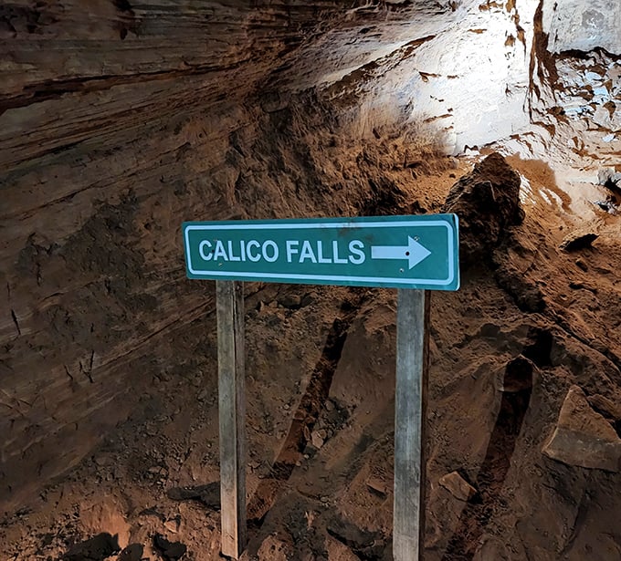 The "Calico Falls" sign points the way to yet another underground marvel. Cave exploration is basically a treasure hunt for grown-ups.