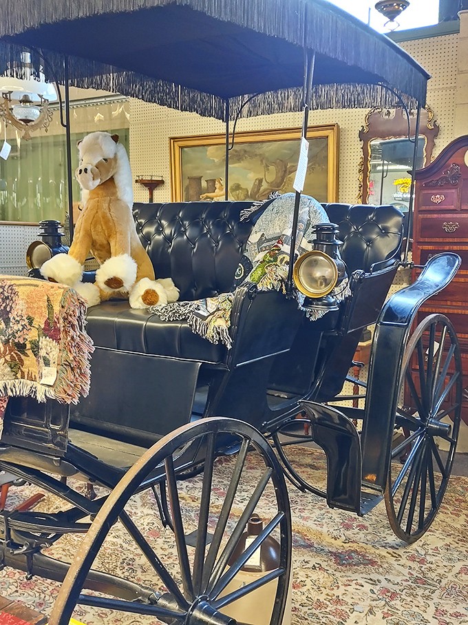 A vintage carriage that puts modern luxury vehicles to shame. That teddy bear isn't just along for the ride—he's been waiting a century for someone to take him home.