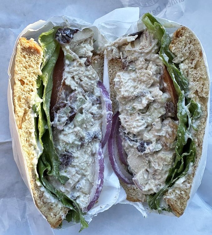 This chicken salad sandwich isn't just lunch—it's edible architecture with layers of flavor between perfectly toasted bread.