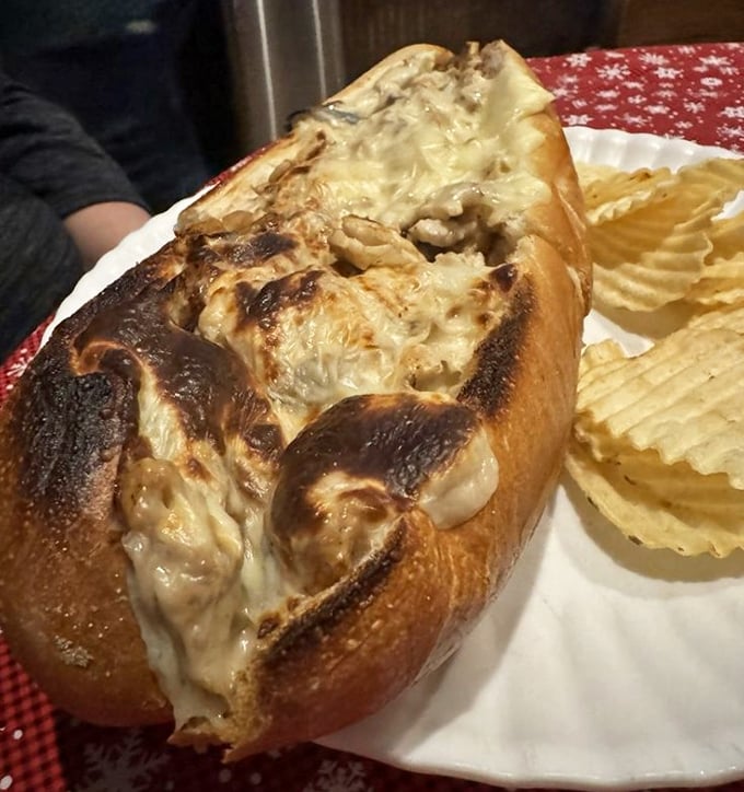 This sandwich isn't melting—it's surrendering to its own deliciousness, with cheese cascading over the sides in glorious abandon.
