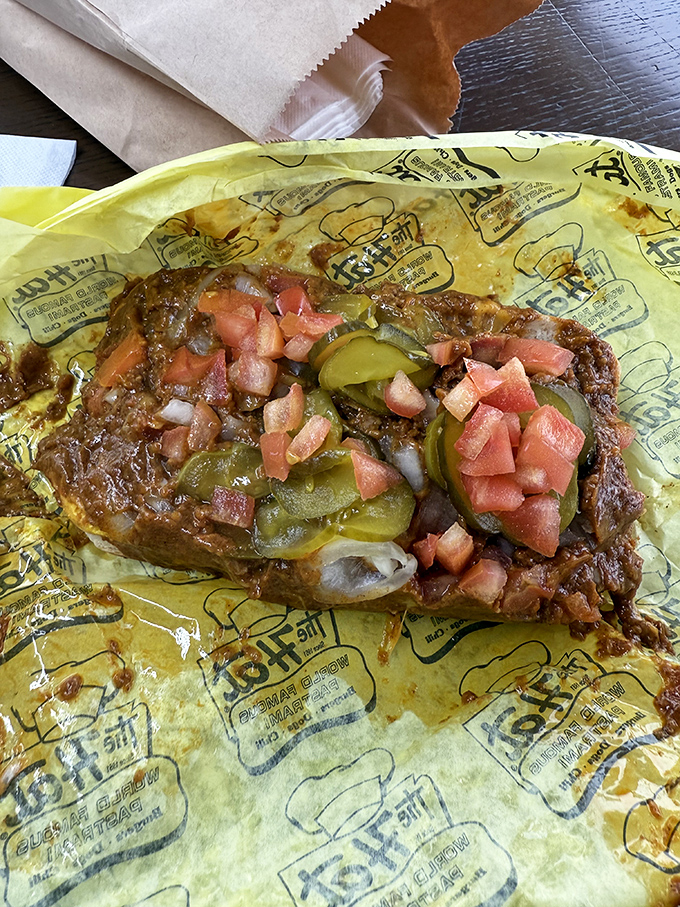 Not just a chili cheese dog - a masterpiece of excess. The diced tomatoes and pickles add a touch of freshness to this beautiful mess.