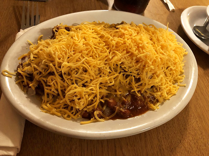 Chili spaghetti under a protective blanket of cheese – Midwest fusion cuisine that warms you from the inside out on chilly Ohio evenings.