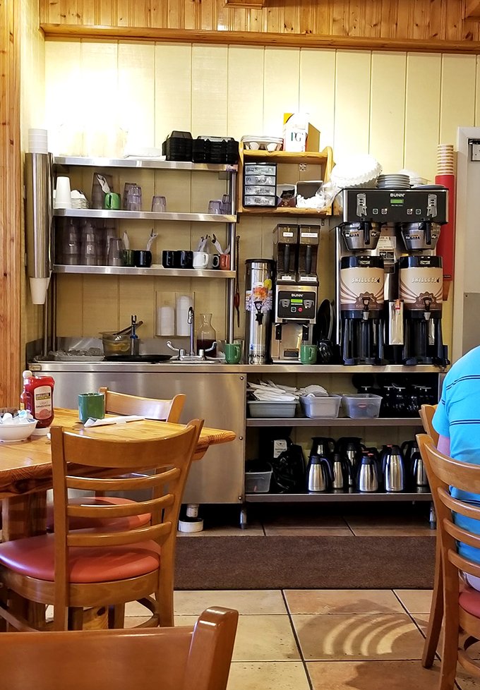 The coffee station – where liquid motivation meets morning ritual. Those thermal carafes hold the key to civilization.