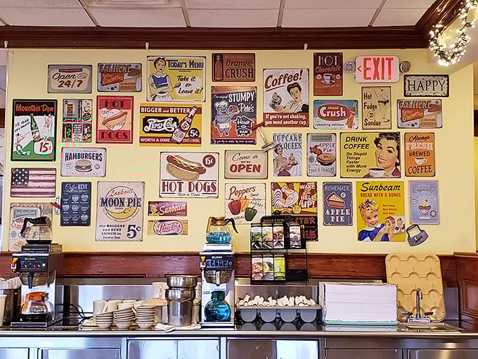 The wall of vintage signs creates a nostalgic backdrop that reminds us why diners remain America's most democratic dining institutions.