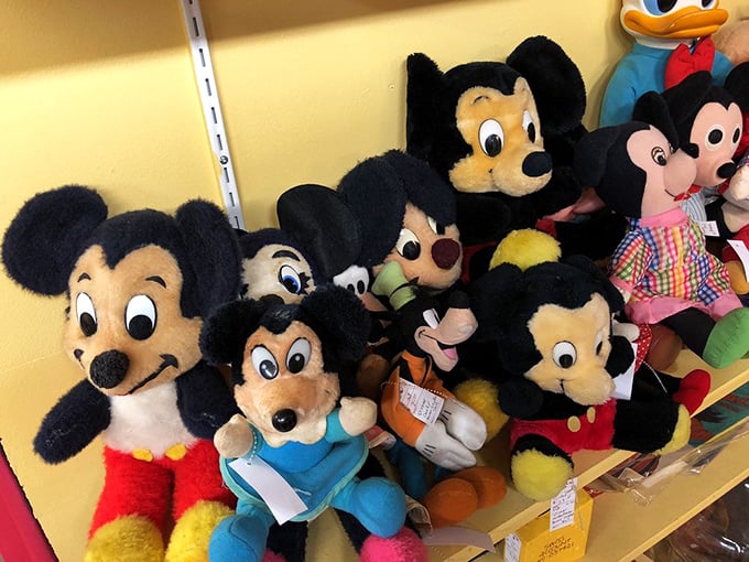 Mickey through the decades! Each plush face represents a different era of childhood magic and parental wallet-emptying.