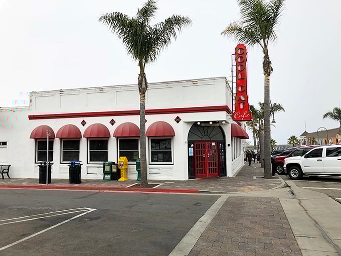 The Cool Cat Cafe's classic white building with red awnings practically screams "come in for a milkshake" in the universal language of American nostalgia.