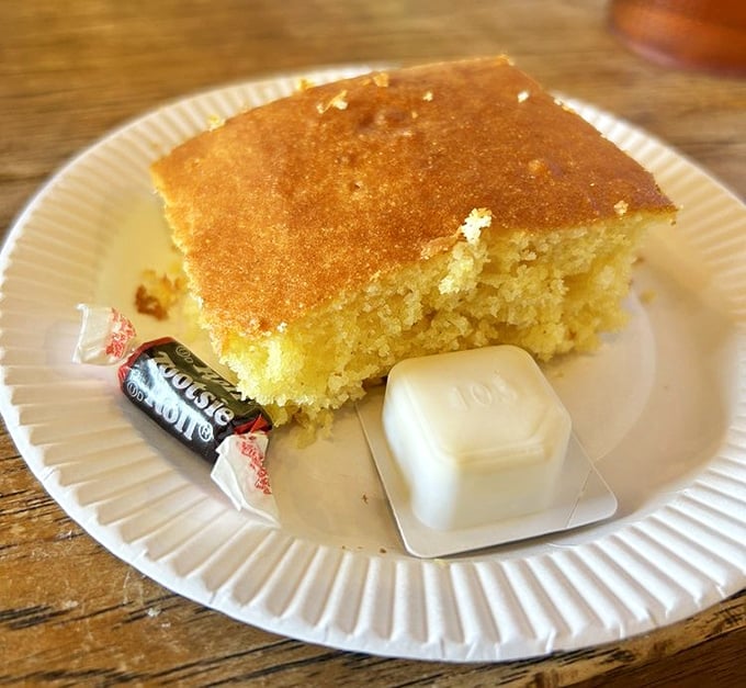 This cornbread isn't just a side—it's the golden crown jewel of the meal, with butter melting like a royal scepter.