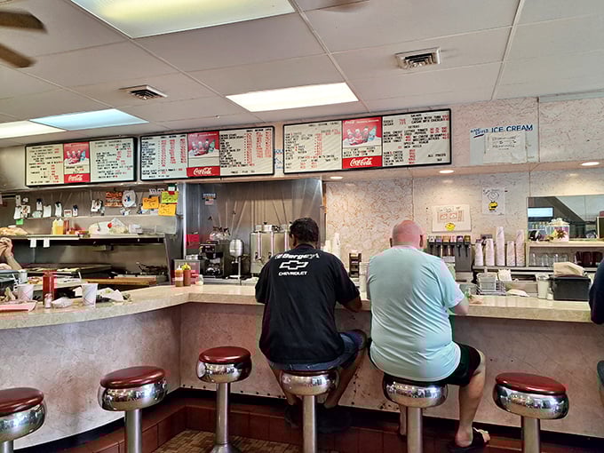 The menu boards tell the story of Lou's priorities—straightforward food without pretense. No avocado toast or small plates in sight.