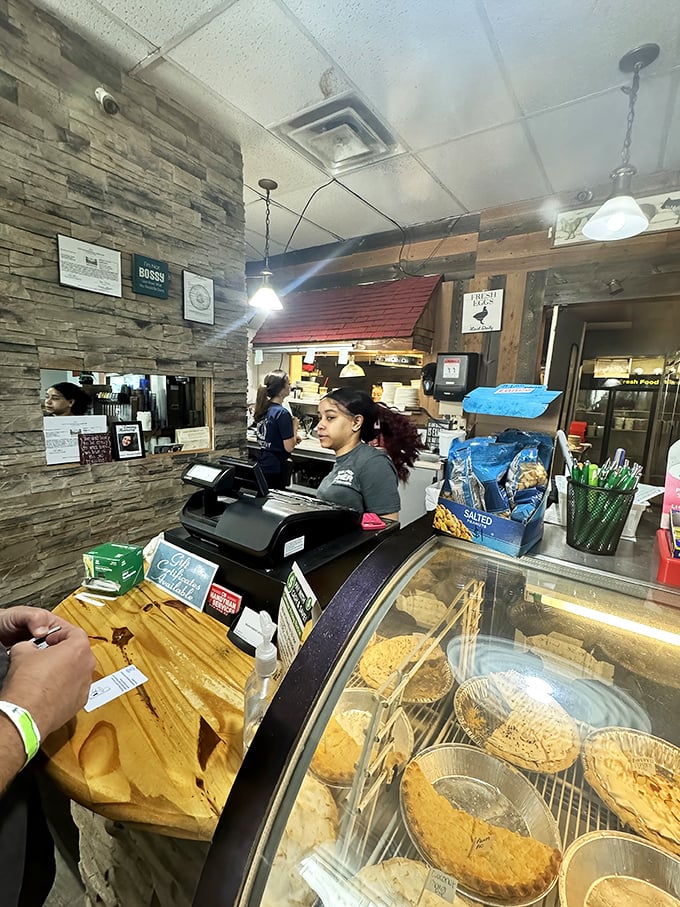 The counter area – where solo diners find community and the pie rotation schedule is considered breaking news.
