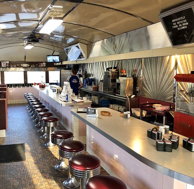 The counter view—where diner magic happens. This is the front-row seat to breakfast theater, complete with sizzling griddle soundtrack.