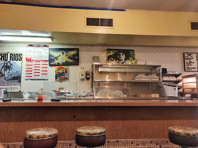 Behind this counter, culinary magic happens without fanfare—just skilled hands preparing dishes that transport you thousands of miles away.