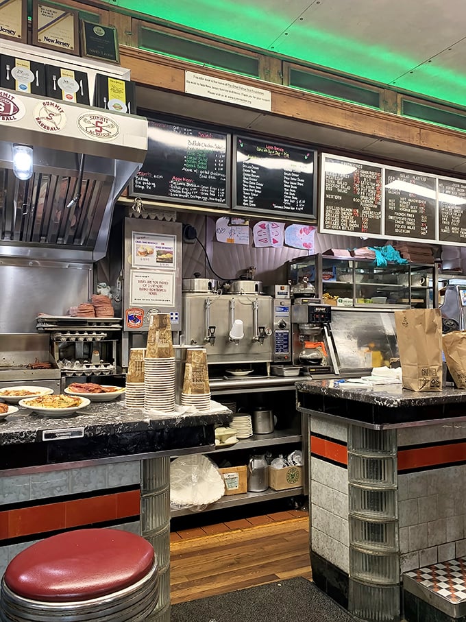 The beating heart of Summit Diner—where coffee urns gleam, orders fly, and the organized chaos of breakfast service unfolds beautifully.