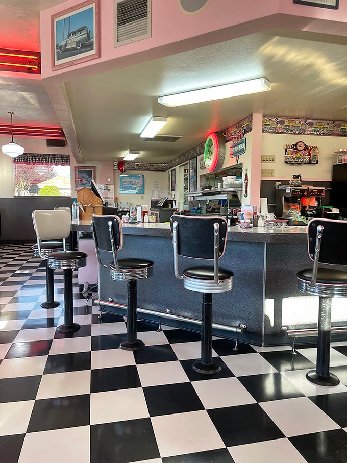 Those classic counter stools aren't just seating—they're ringside seats to the short-order ballet that unfolds behind the counter.