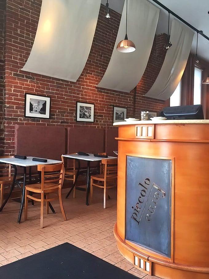 The host station that's witnessed countless "how long is the wait?" conversations. Those fabric panels soften both sound and your impatience.