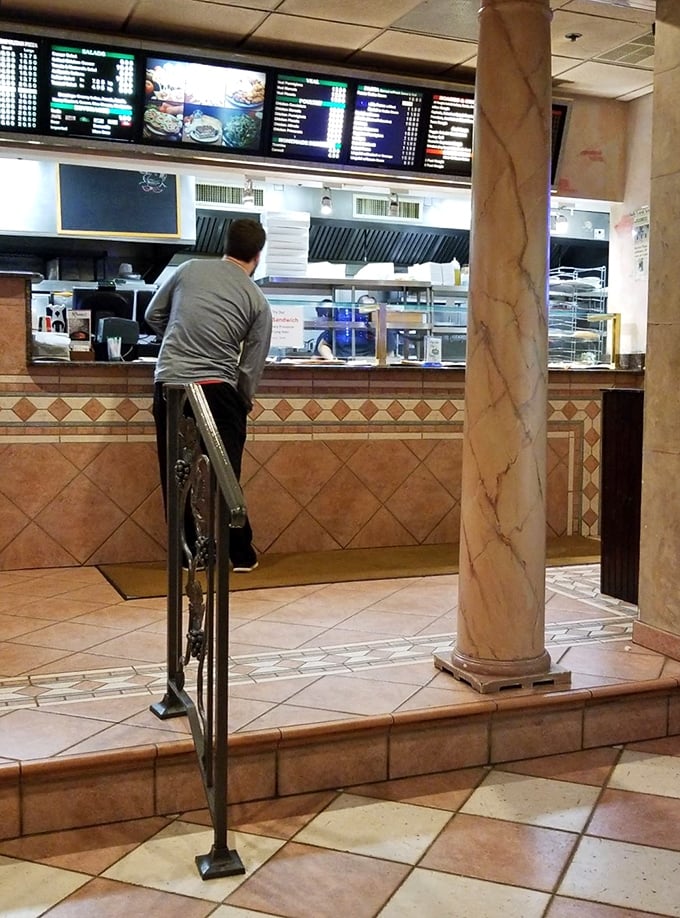 Where anticipation builds as you place your order. The marble columns and classic tile work remind you that some traditions are worth preserving.